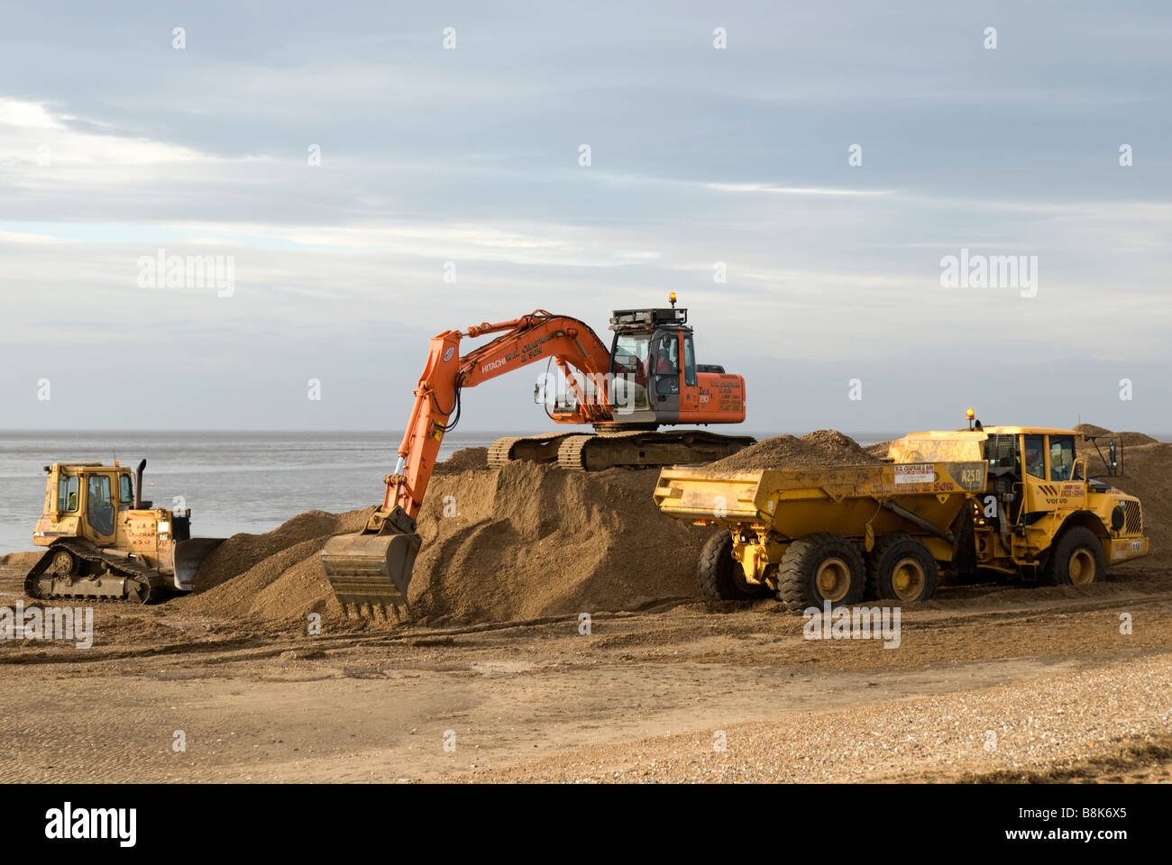Bulldozers’ annual big push to get beaches back in shape Stock Photo ...