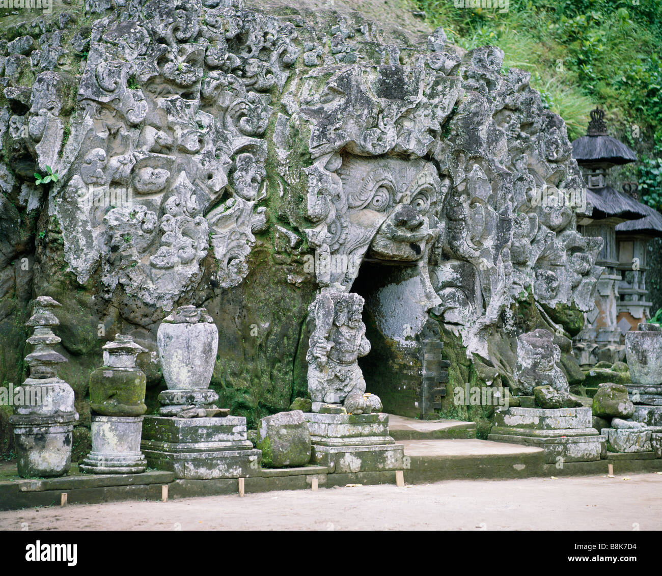 Elephant caves Hindu temple Carved rockface entrance Urns statues ...