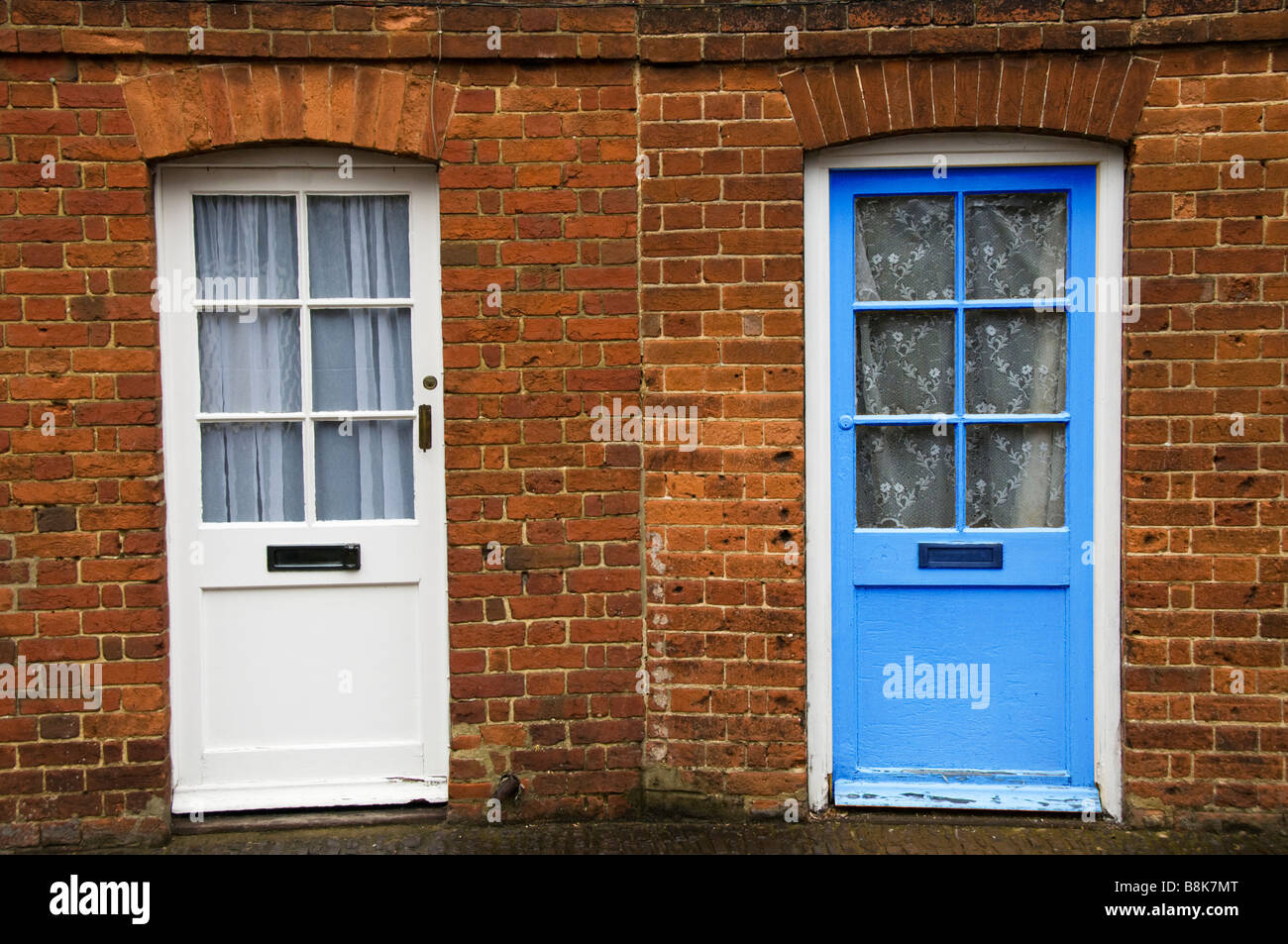 Two doors of cottages adjacent to each other, Farnham, Surrey, UK Stock ...