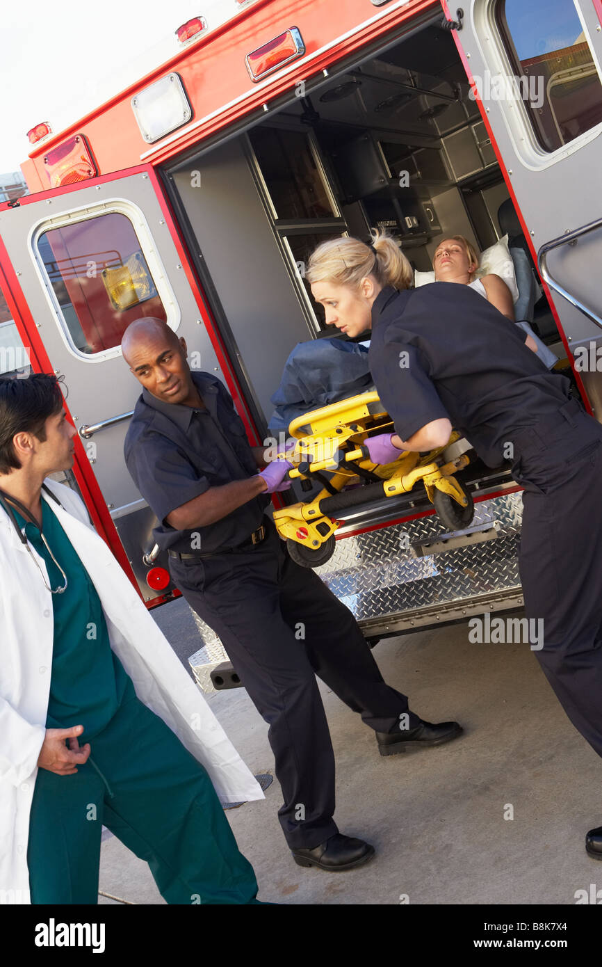 Paramedics and doctor unloading patient from ambulance Stock Photo - Alamy