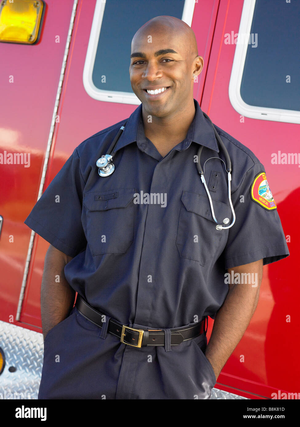 Portrait of paramedic in front of ambulance Stock Photo - Alamy