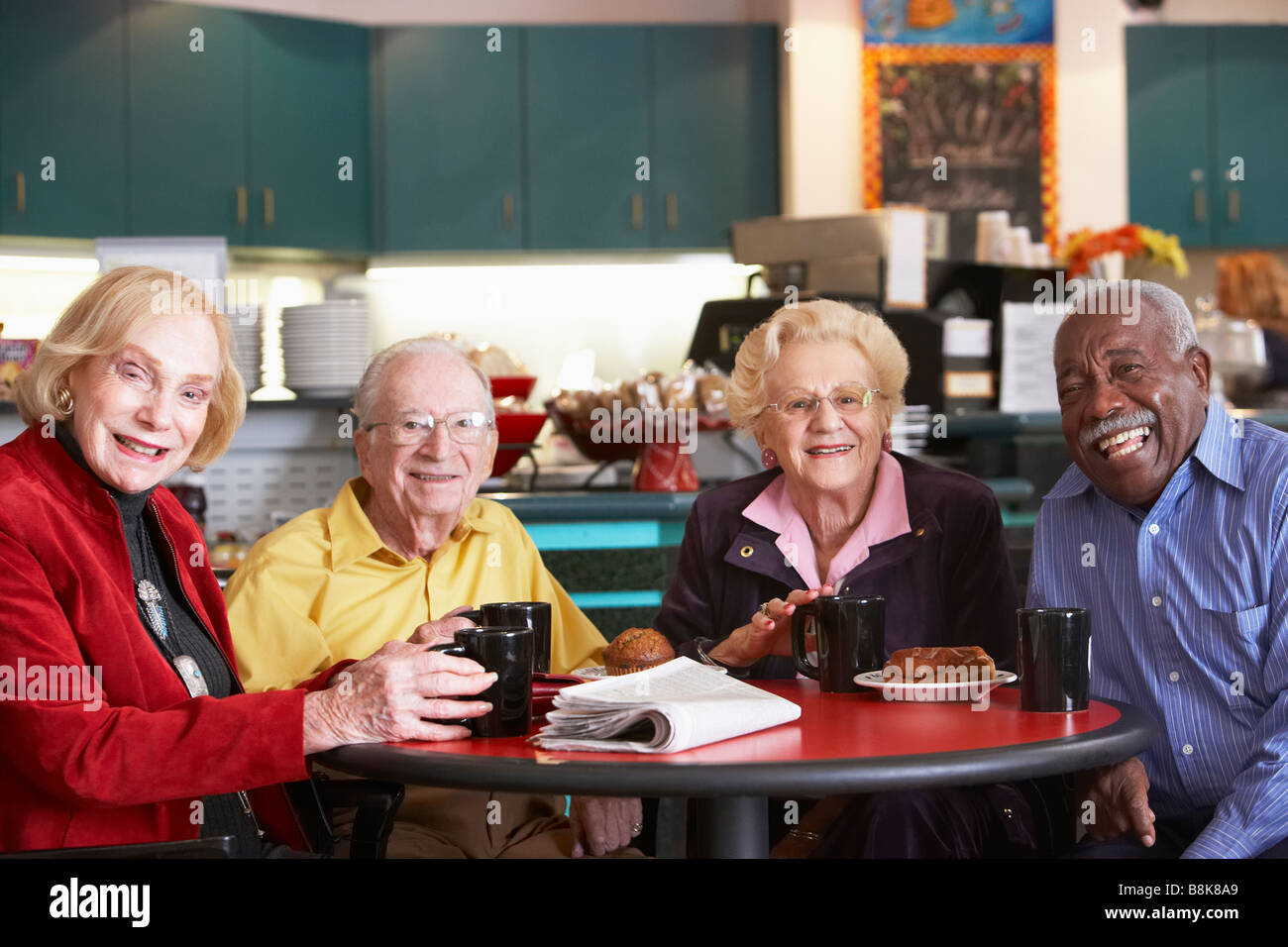 Senior adults having morning tea together Stock Photo - Alamy