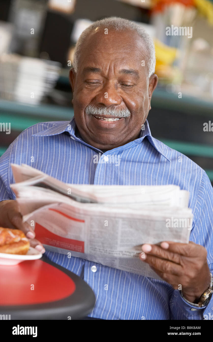 Senior man having morning tea Stock Photo - Alamy