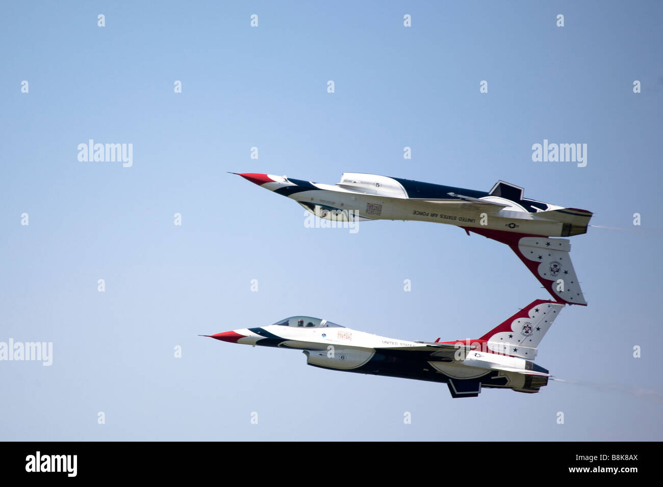 Two USAF Thunderbirds stunt pilots flying in close formation (one is ...