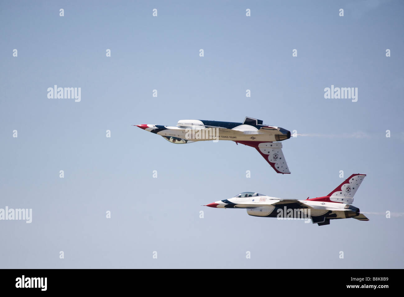 Two USAF Thunderbirds stunt pilots flying in close formation (one is ...