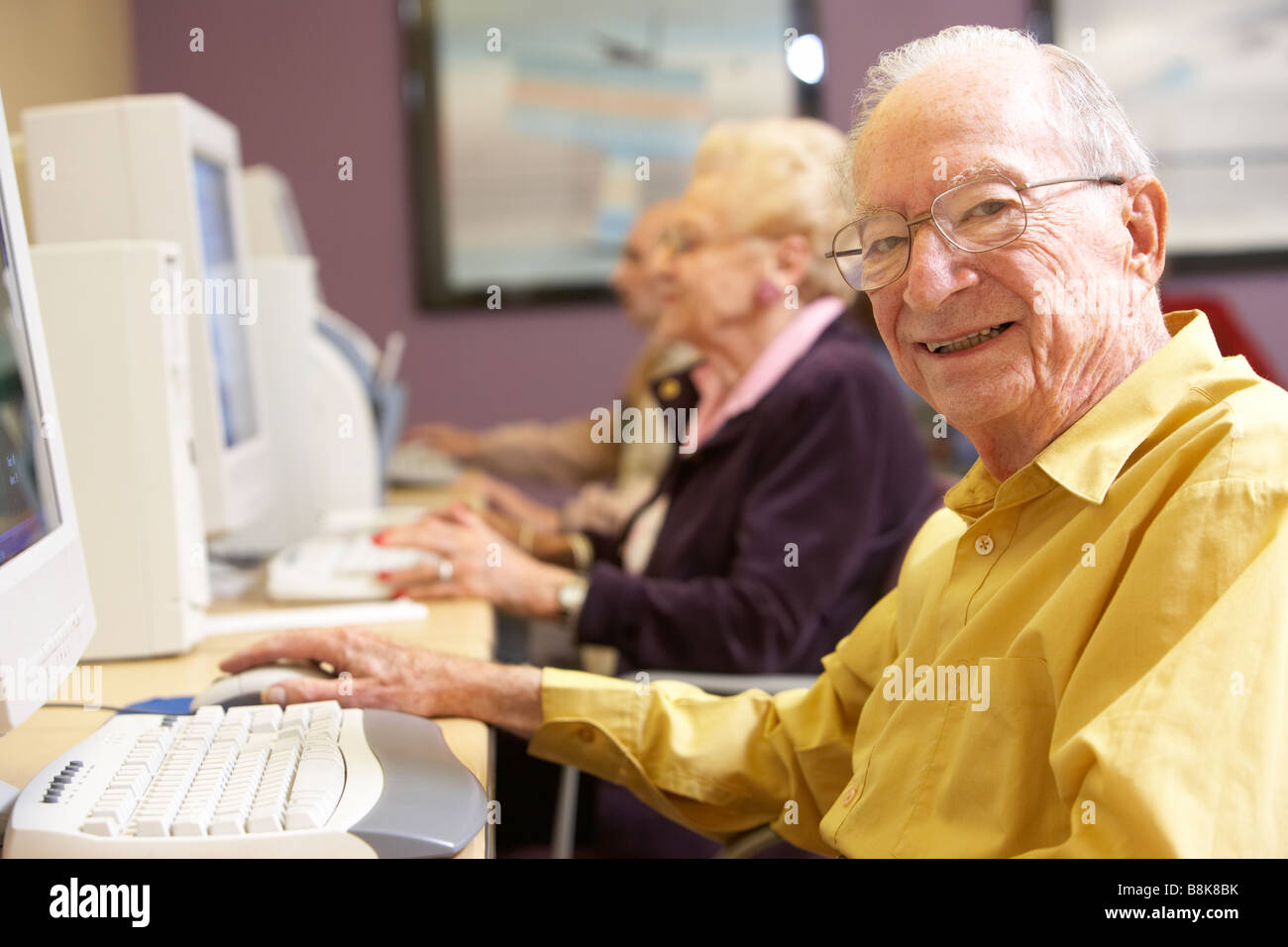 Senior man using computer Stock Photo - Alamy