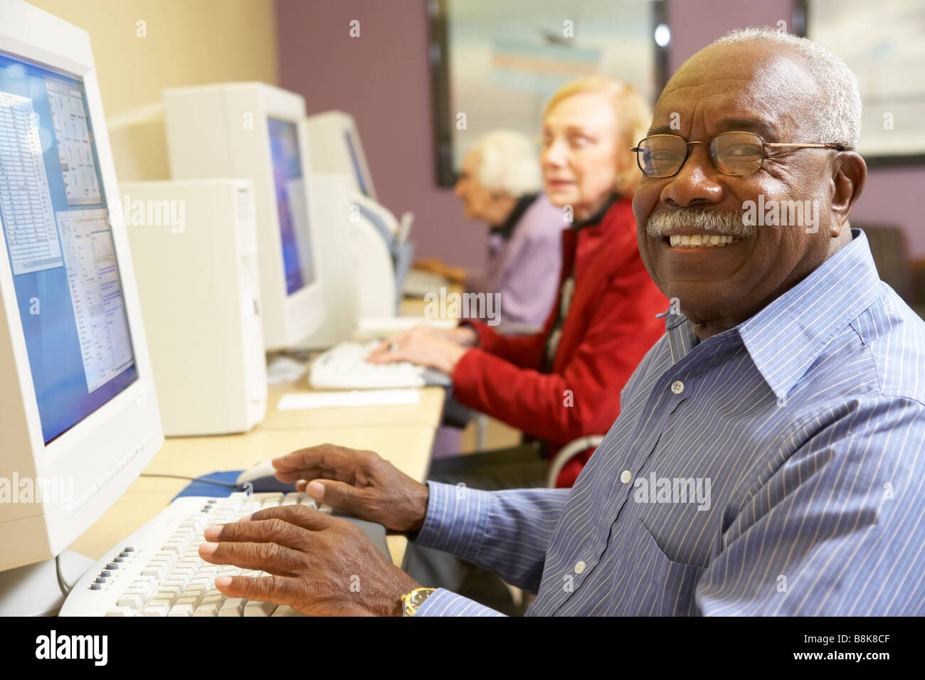 Senior man using computer Stock Photo - Alamy