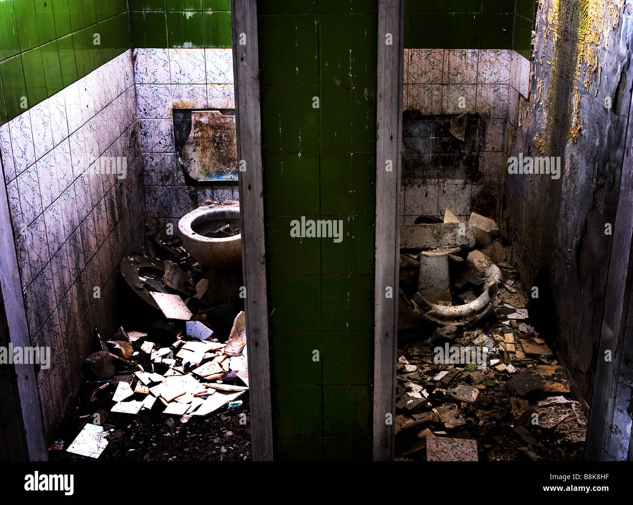 Smashed toilets in a derelict building Stock Photo - Alamy