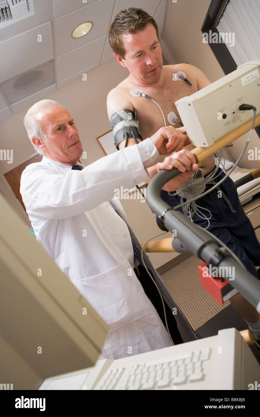 Doctor Monitoring Patient During Health Check Stock Photo - Alamy