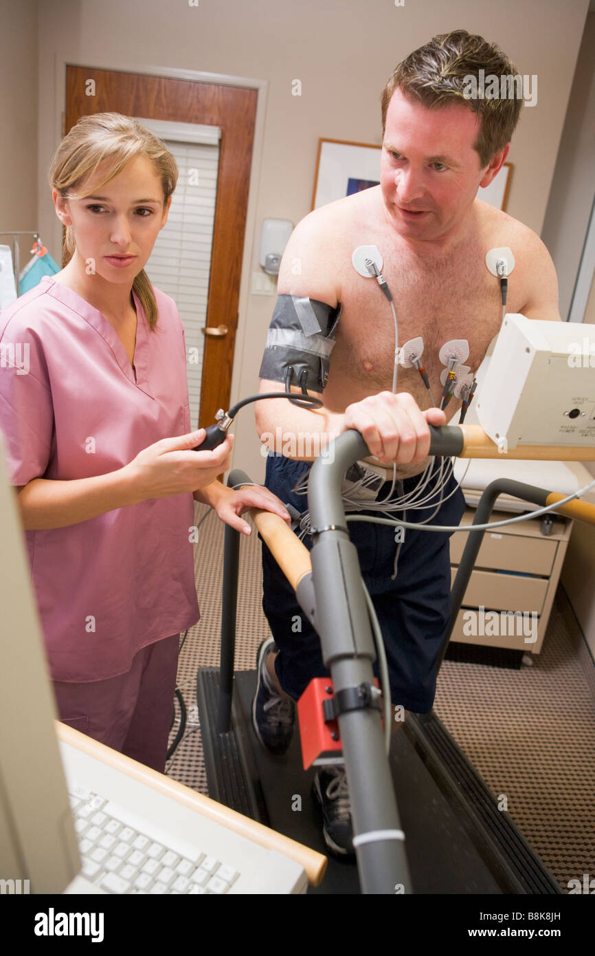 Nurse With Patient During Health Check Stock Photo - Alamy