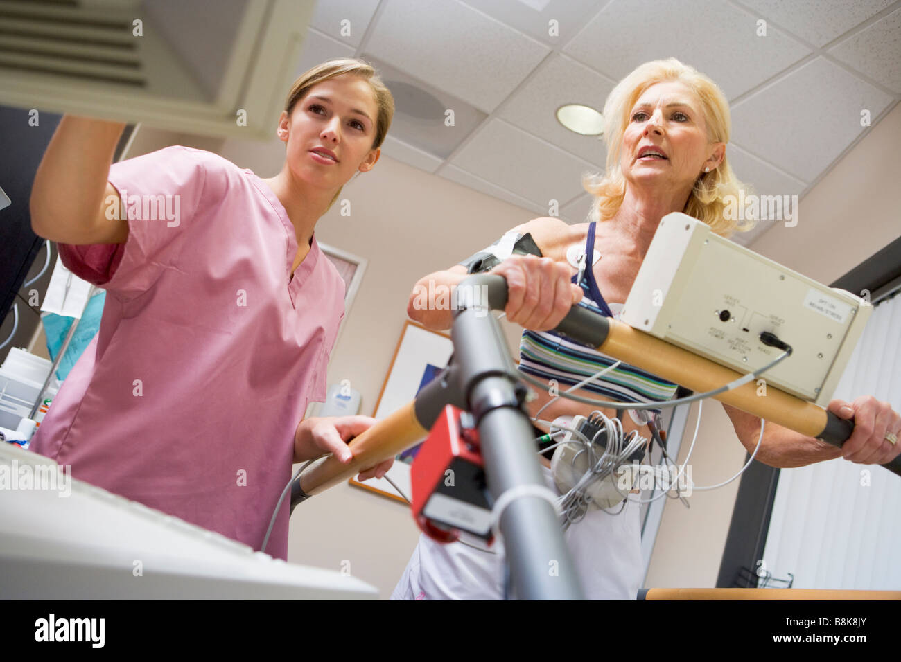 Nurse With Patient During Health Check Stock Photo - Alamy