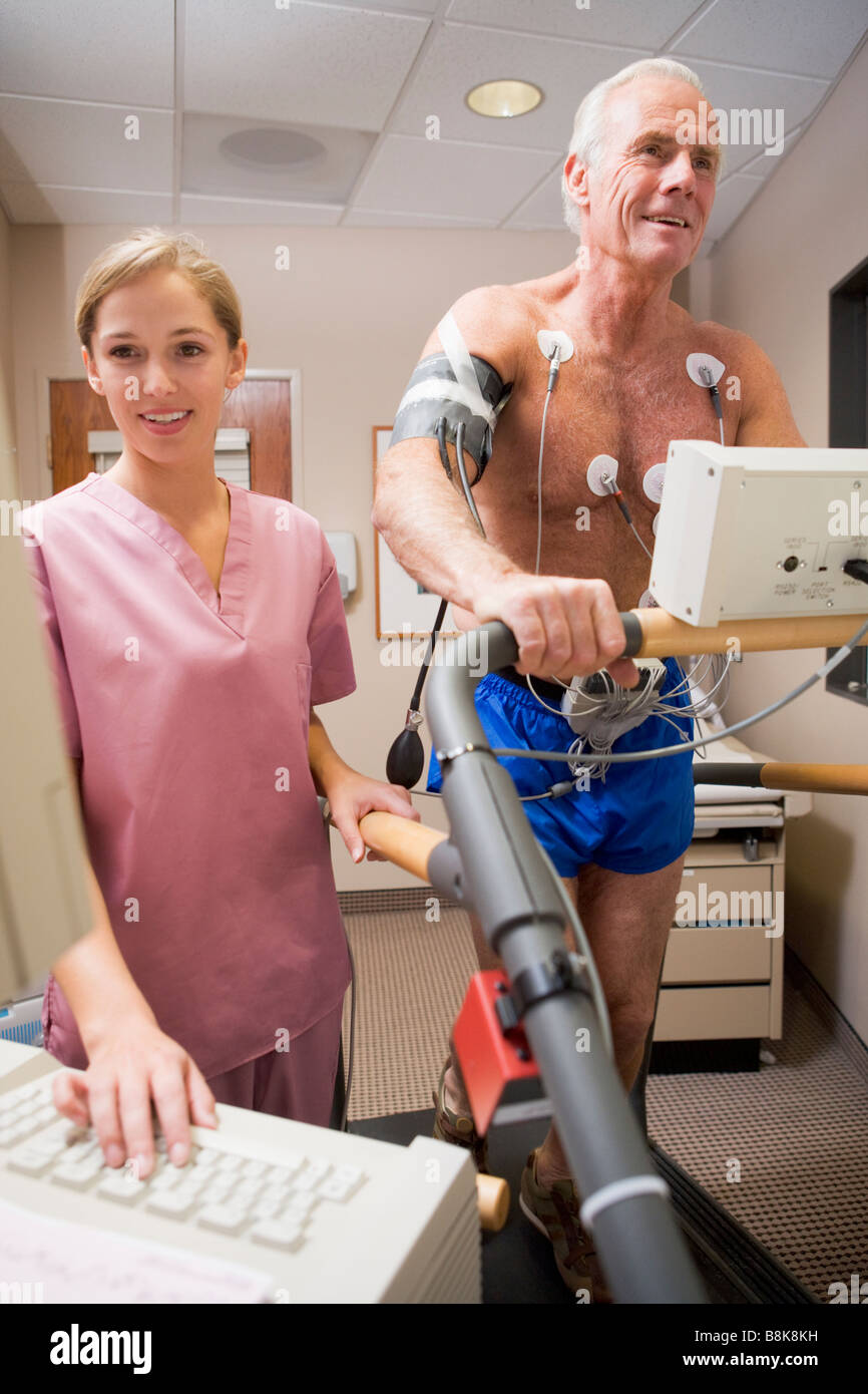Nurse With Patient During Health Check Stock Photo - Alamy