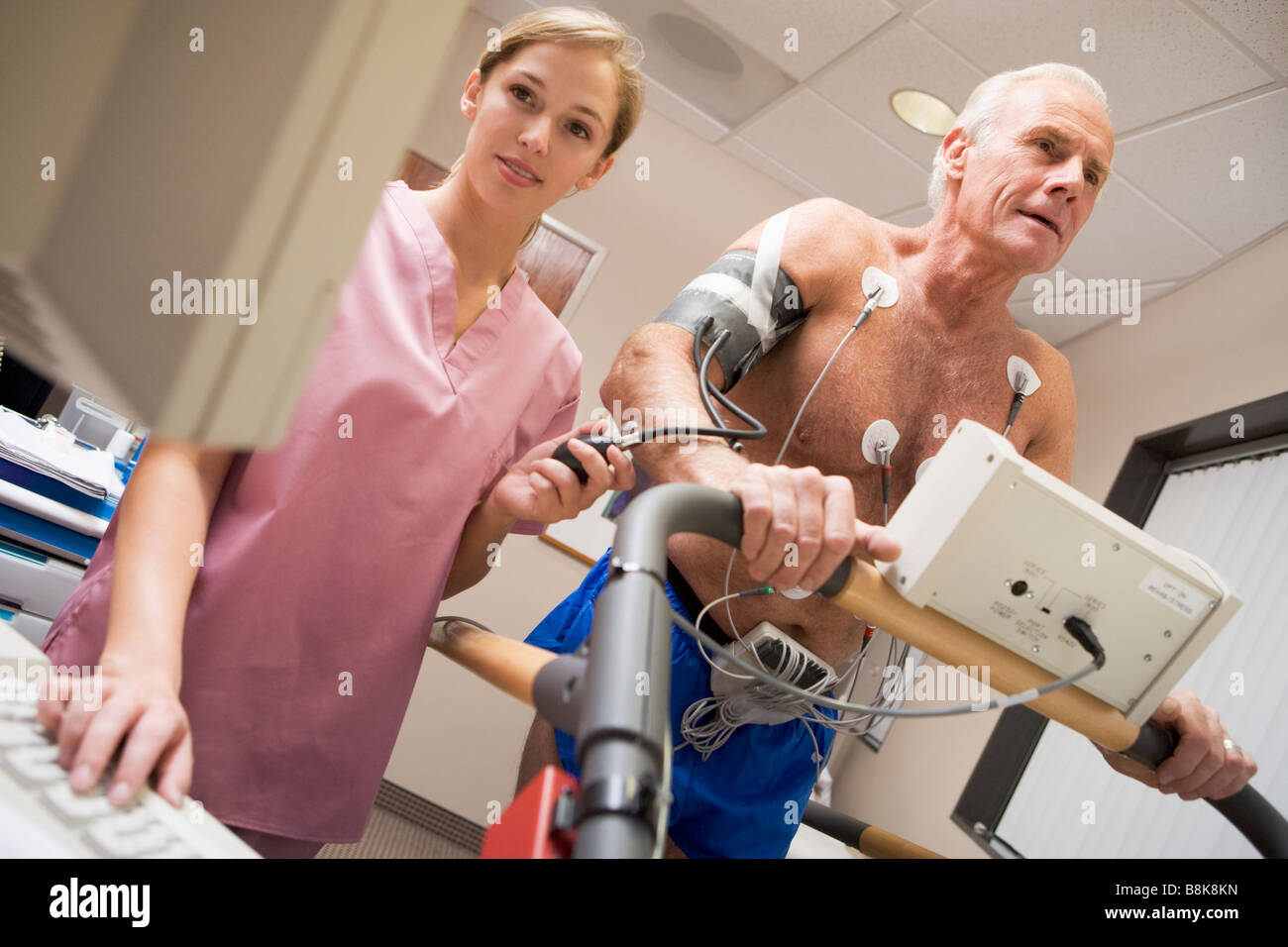 Nurse With Patient During Health Check Stock Photo - Alamy