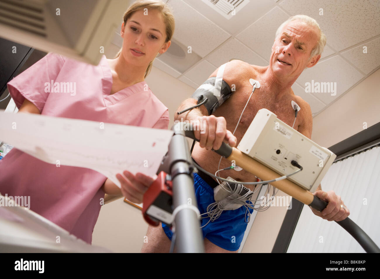 Nurse With Patient During Health Check Stock Photo - Alamy