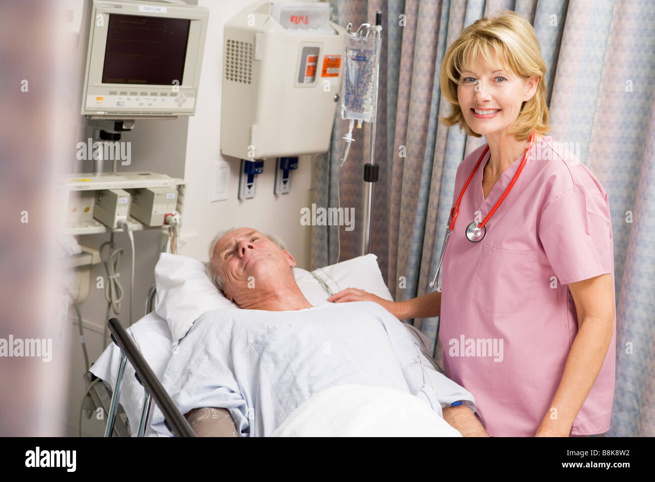 Doctor Caring For Patient Stock Photo - Alamy
