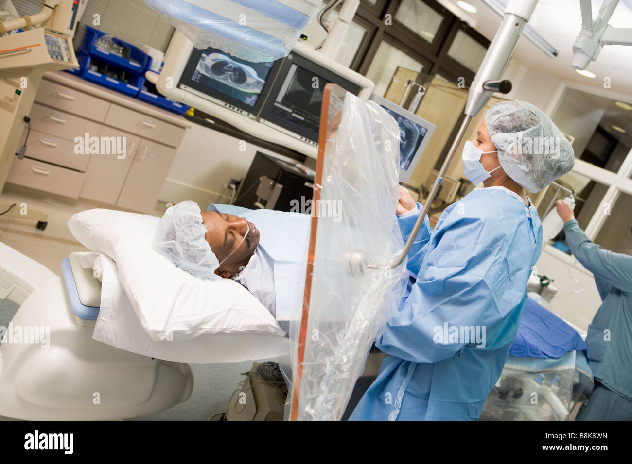 Surgeon Operating On Patient Stock Photo - Alamy