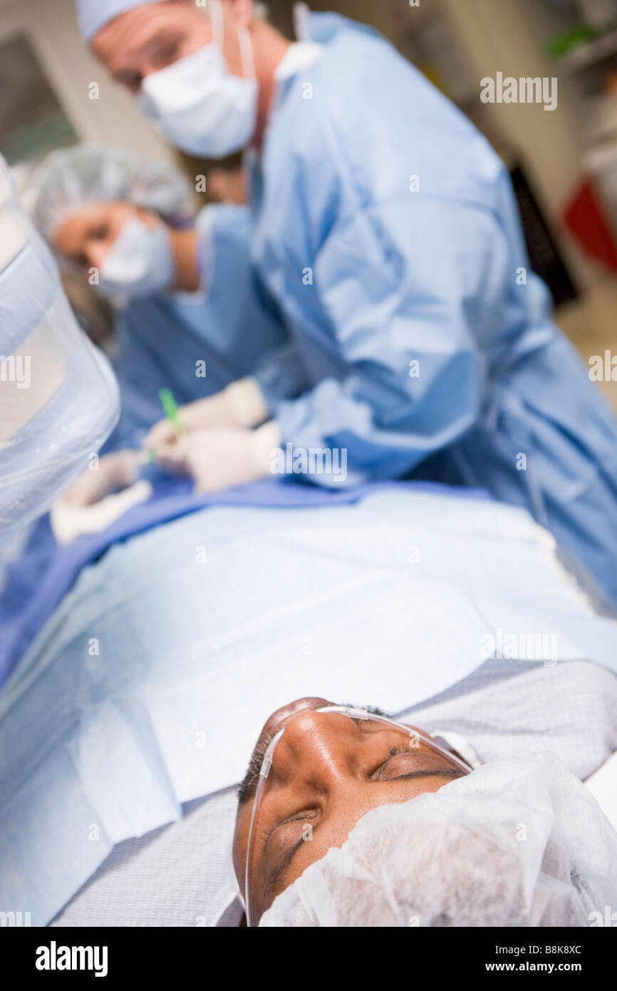 Surgeons Operating On Patient Stock Photo - Alamy