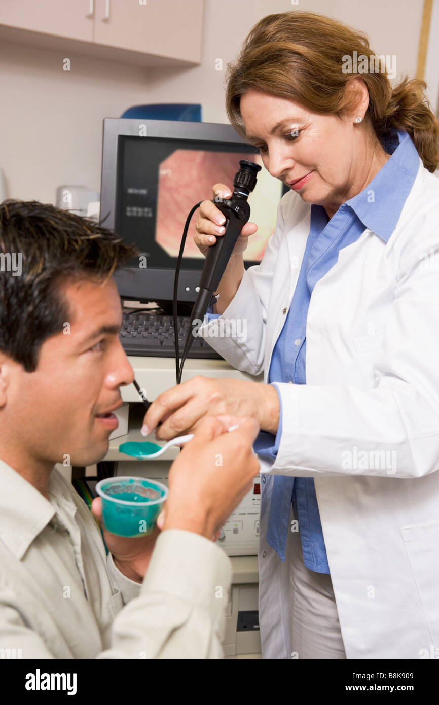 Doctor Performing Check-Up On Patient Stock Photo - Alamy