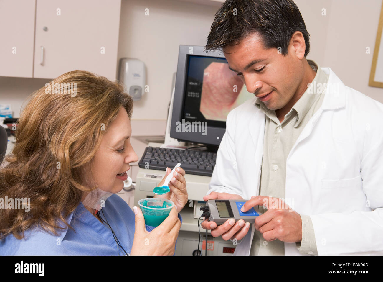 Doctor Performing Check-Up On Patient Stock Photo - Alamy