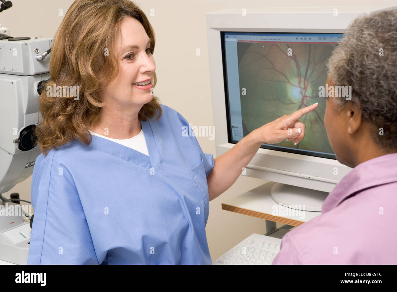 Nurse Explaining Eye Exam Results To Patient Stock Photo Alamy nurse-explaining-eye-exam-results-to-patient-stock-photo-alamy