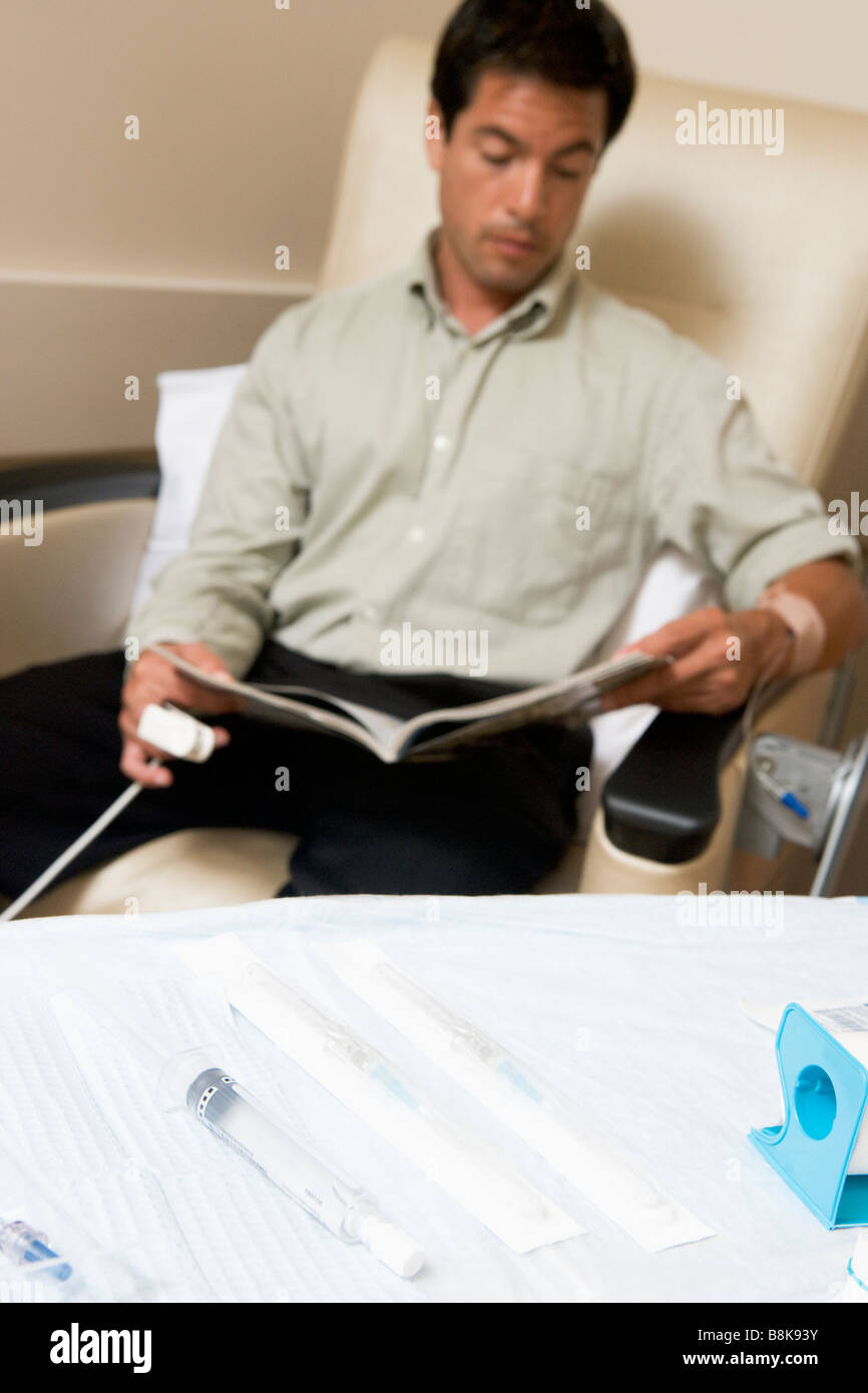 Patient Reading A Magazine While Being Monitored Stock Photo - Alamy