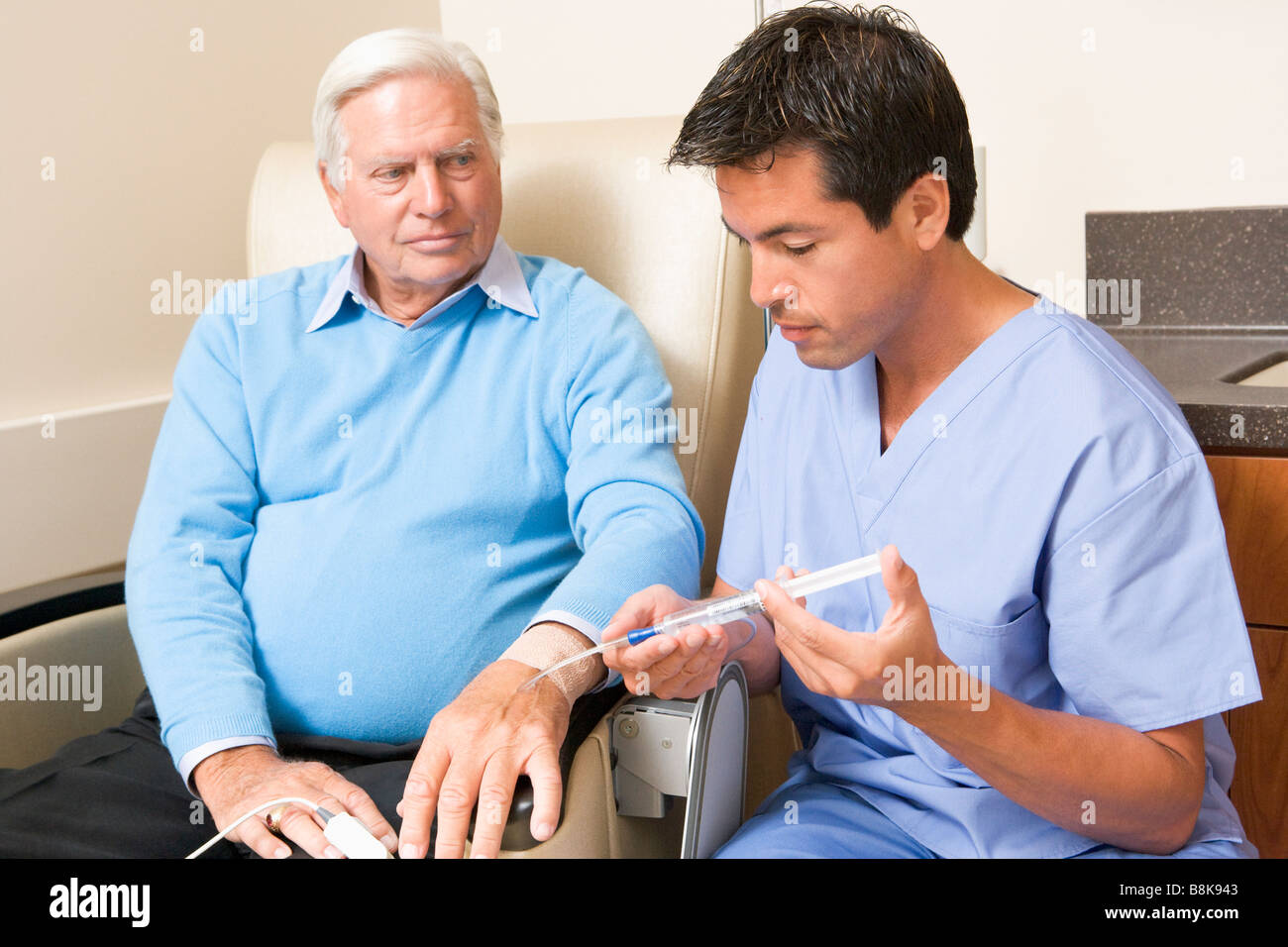 Nurse Giving Patient An Injection Stock Photo - Alamy
