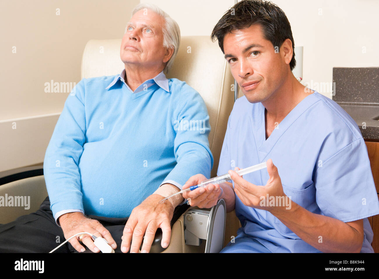 Nurse Giving Patient An Injection Stock Photo - Alamy