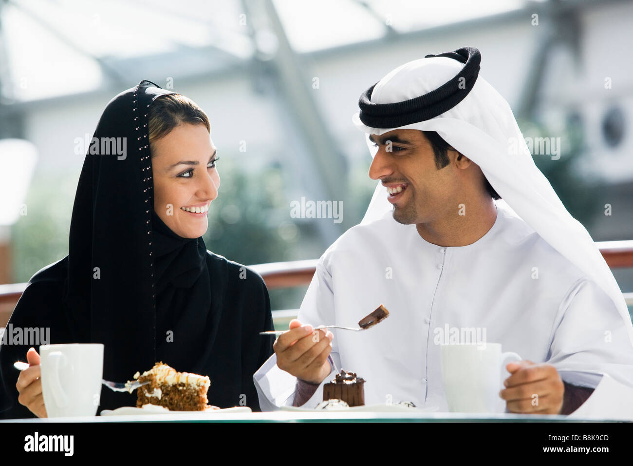 Young man woman eating cake restaurant hi-res stock photography and ...