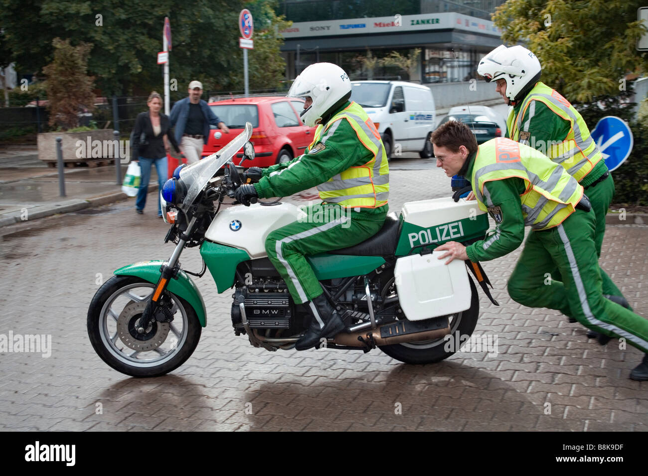 German police officers try to push start one of their motorcycles Stock ...