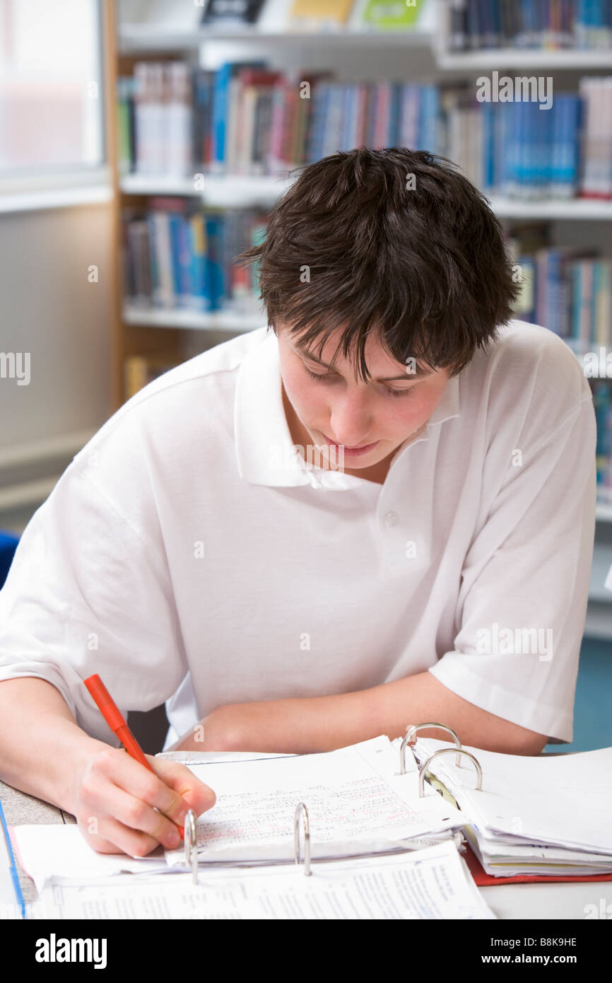 Student writing and studying Stock Photo - Alamy