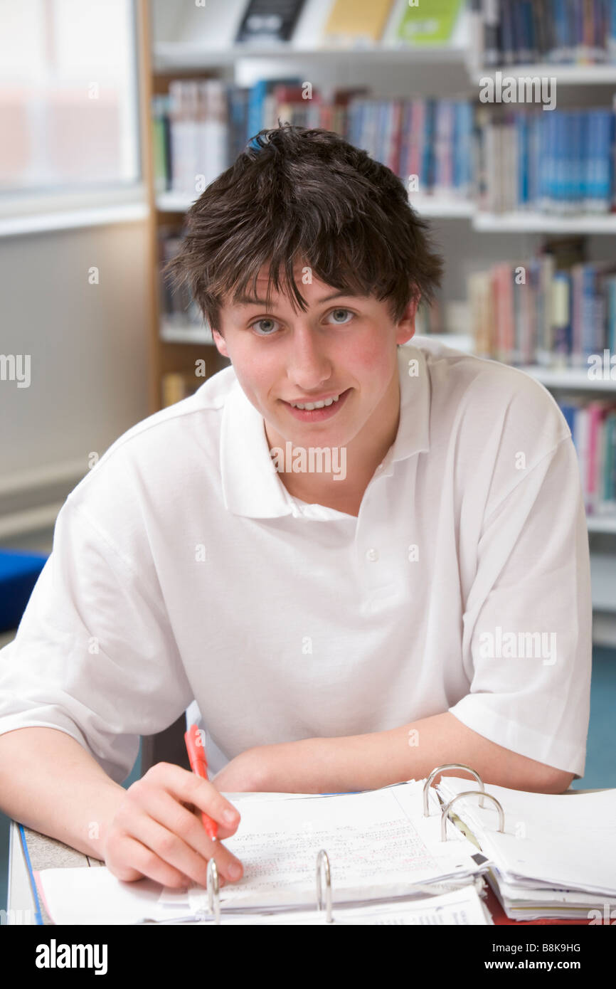 Student writing and studying Stock Photo - Alamy