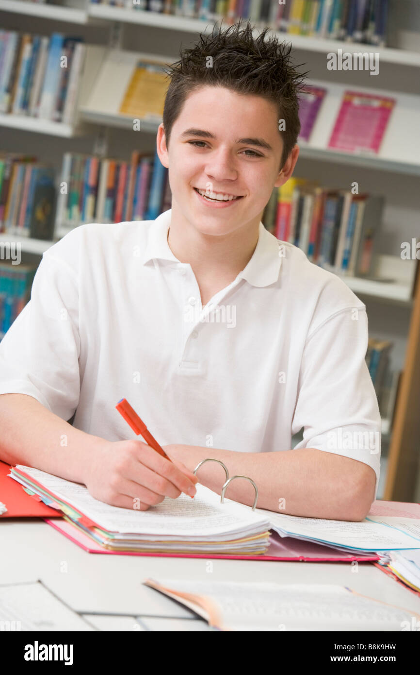 Student writing and studying Stock Photo - Alamy