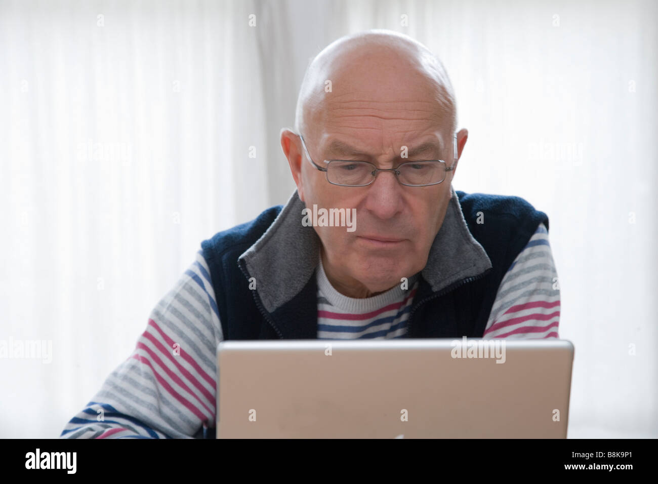Older man with laptop Stock Photo - Alamy