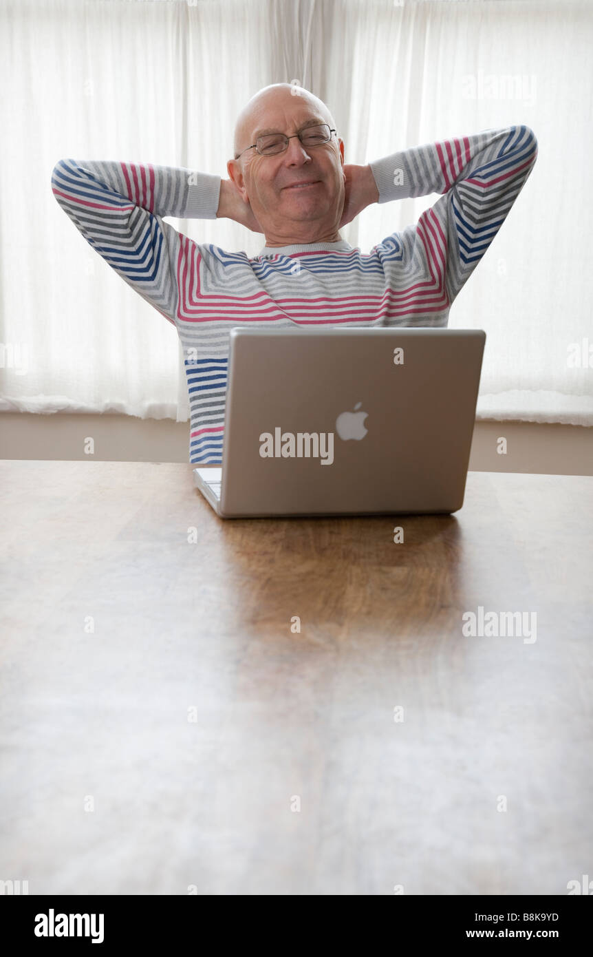 Older man with laptop Stock Photo - Alamy