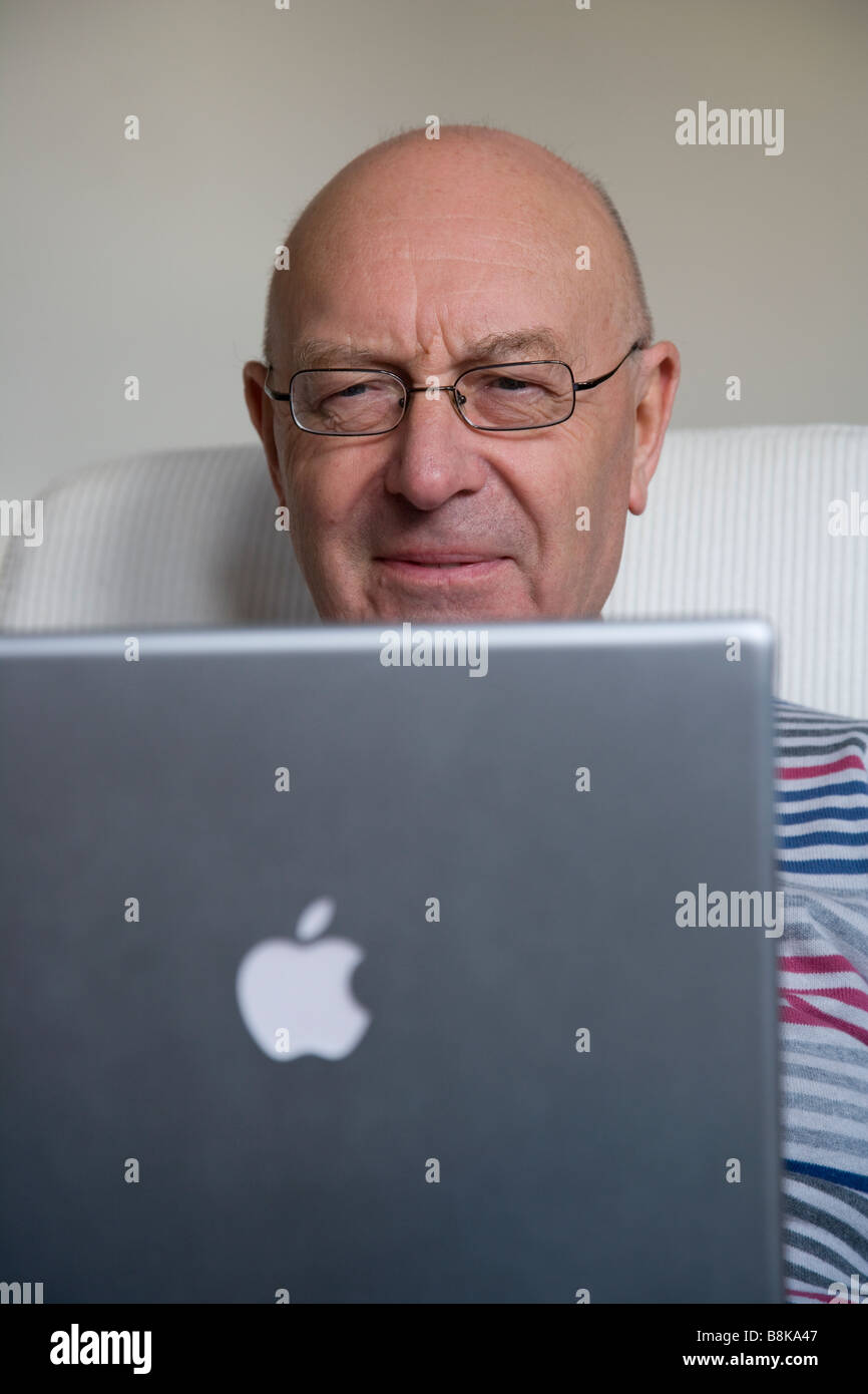 Older man with laptop Stock Photo - Alamy