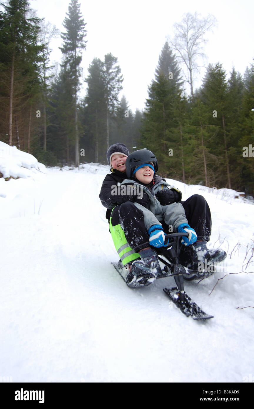 Sledge winter sledging boys fun hi-res stock photography and images - Alamy