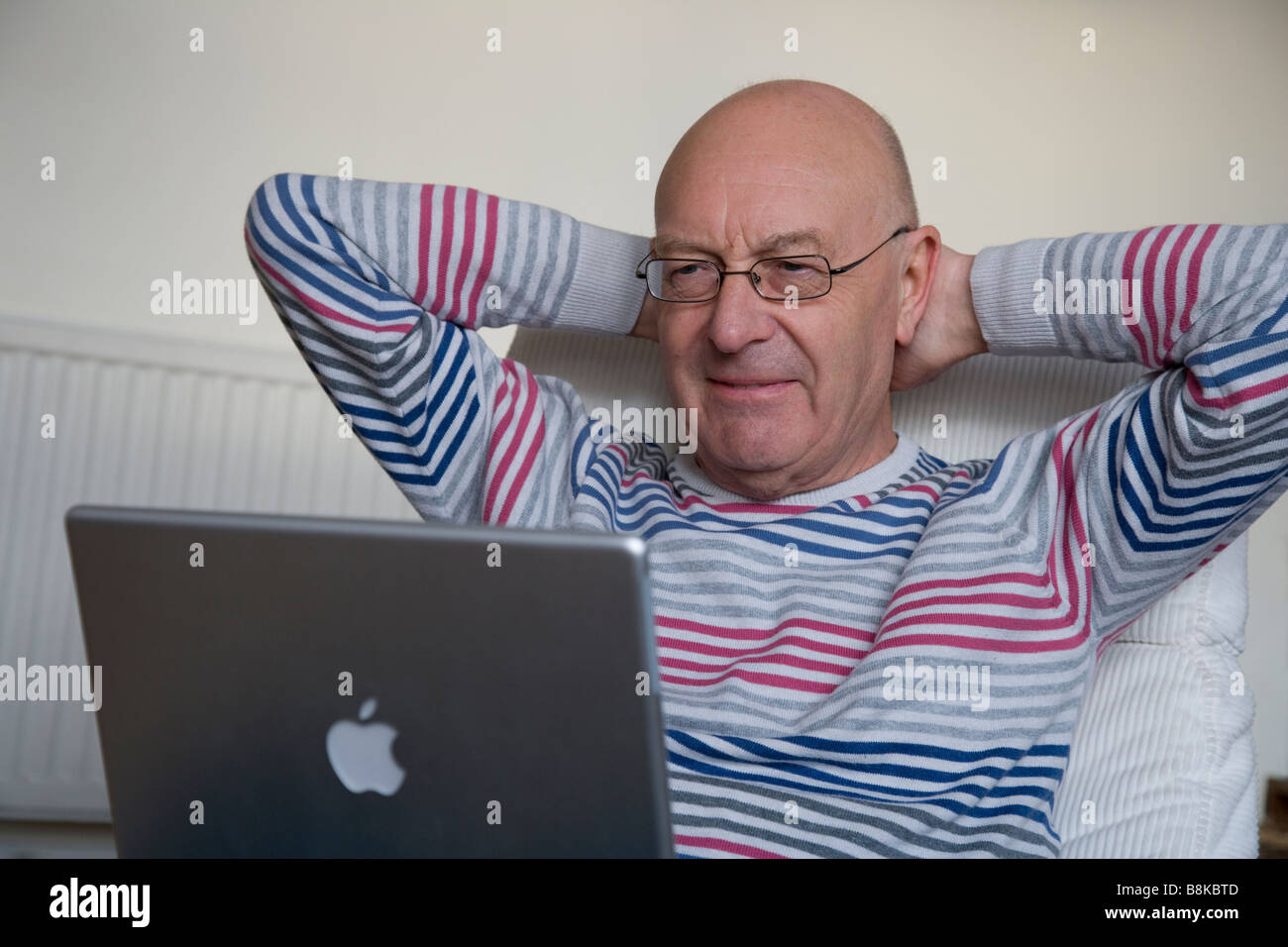 Older man with laptop Stock Photo - Alamy