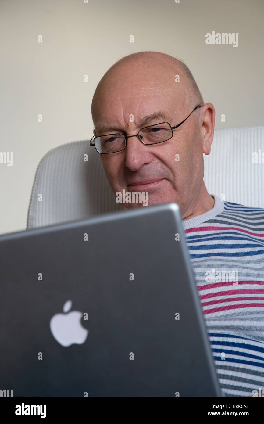 Older man with laptop Stock Photo - Alamy