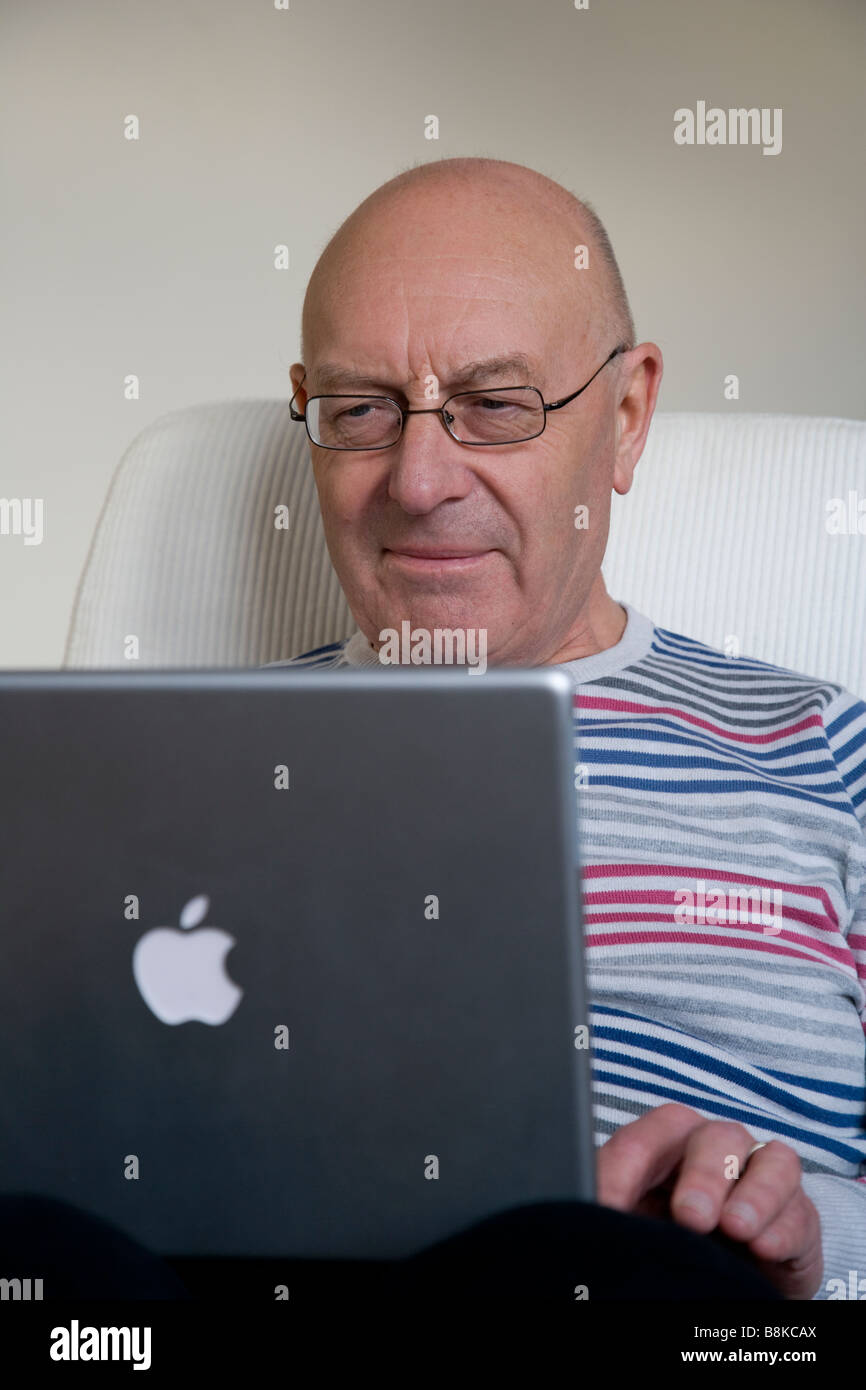 Older man with laptop Stock Photo - Alamy