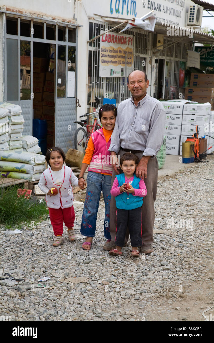 A Turkish family group, proud father and his three children pose for ...