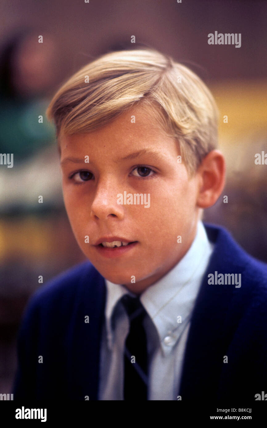 blond boy serious expresion face portrait look intent direct stare ...