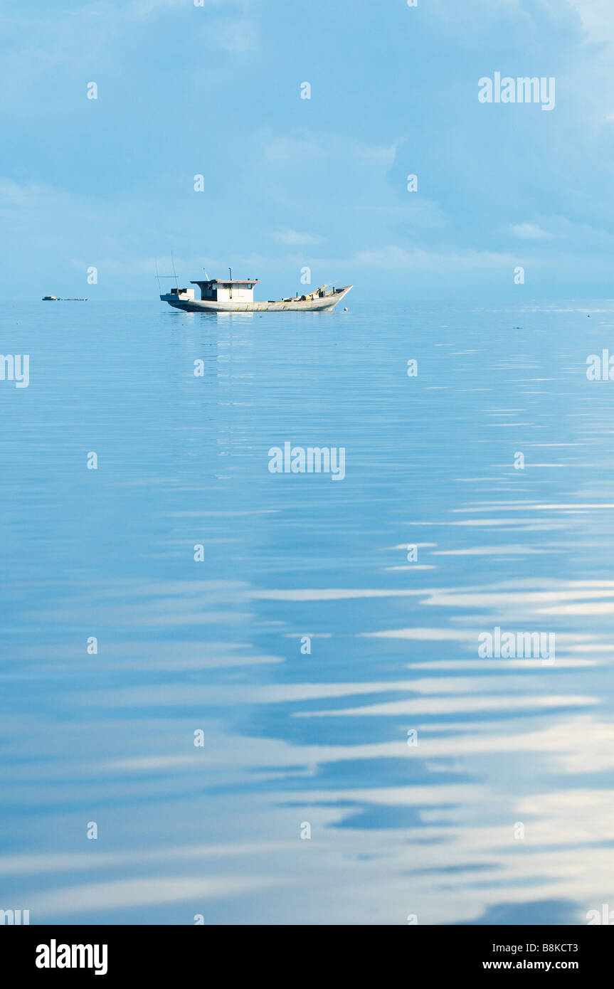 Distant fishing boat hi-res stock photography and images - Alamy