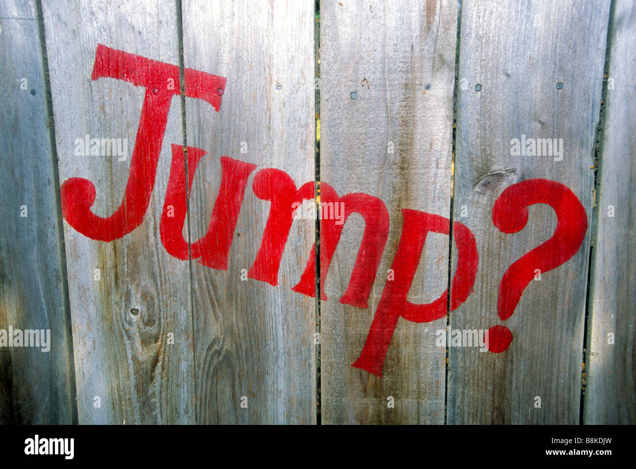 Jump? sign fence wall paint graphic direction question ask red letter ...