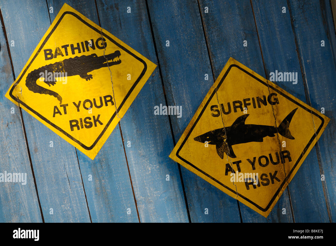 Stock photo of a sign displaying warnings for bathing and surfing Stock ...