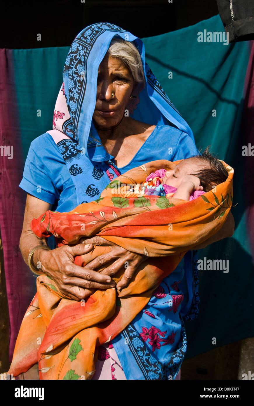 An Indian Grandmother caring for a one month old baby boy - son to the ...