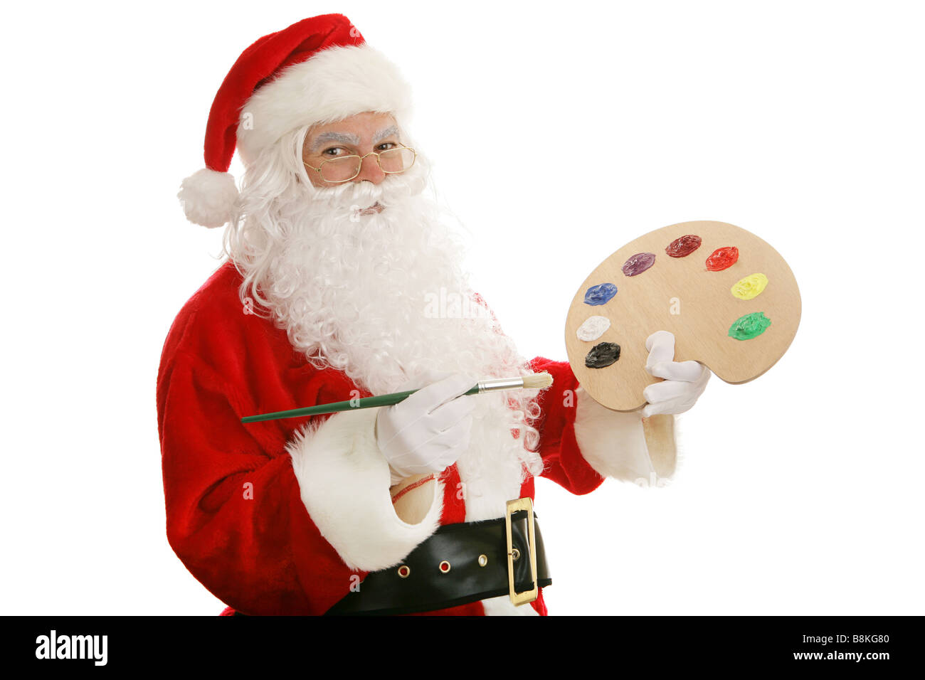 Santa Claus with an artists palette and paint brush Isolated on white ...