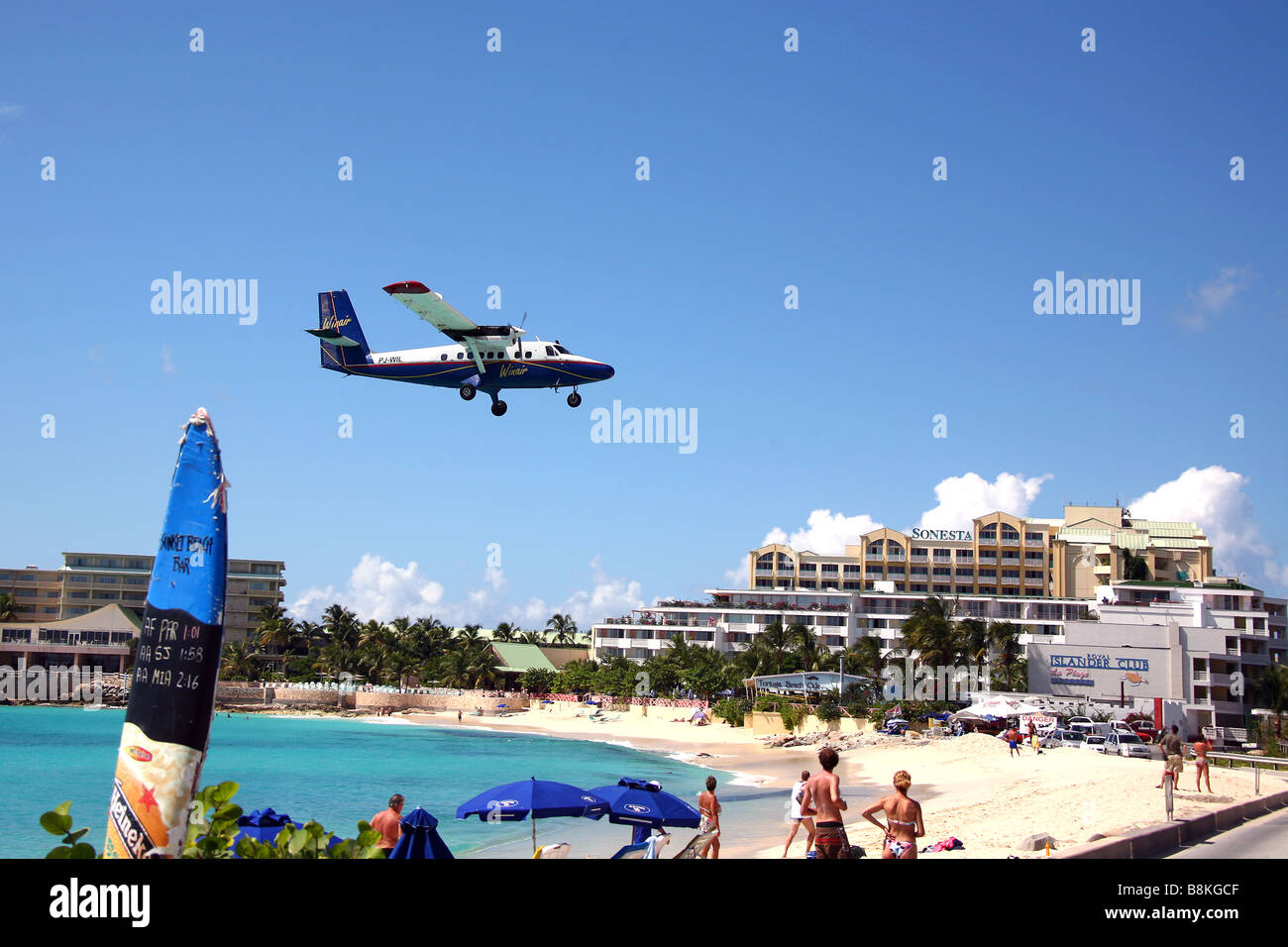 A Winair flight lands on St.Maarten (St.Martin). The airport is famous ...