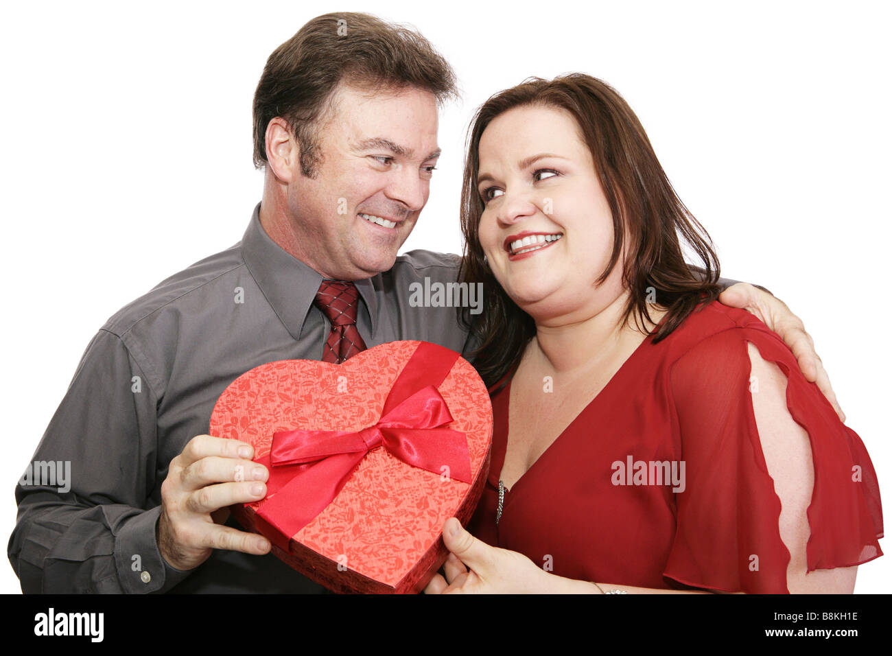 Man giving valentine candy to his lover Isolated on white Stock Photo ...