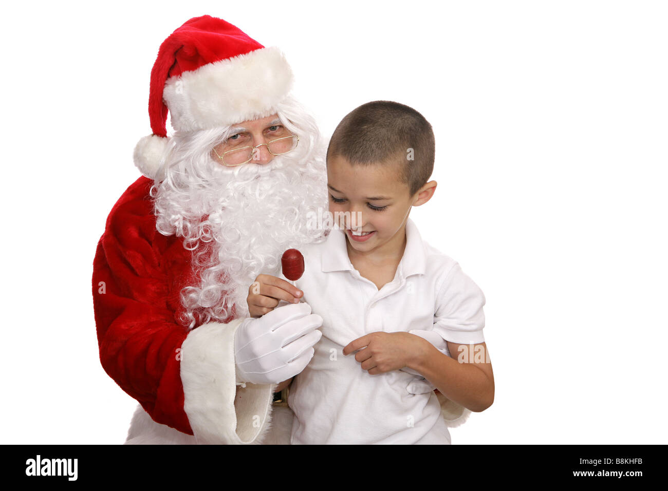 Santa clause and a child at christmas Stock Photo - Alamy