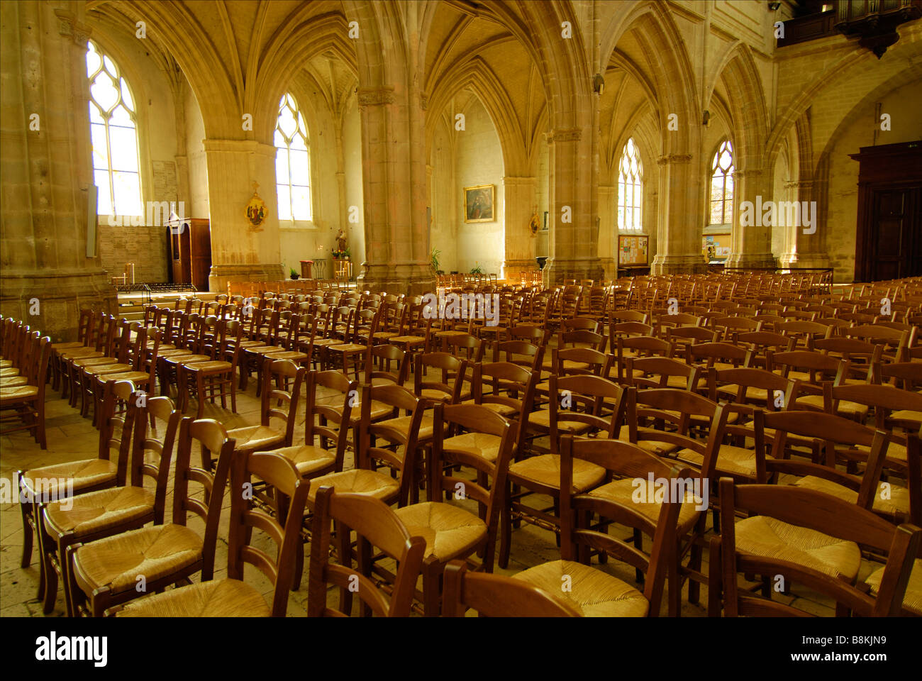 Mystic light in the church empties chairs Stock Photo - Alamy